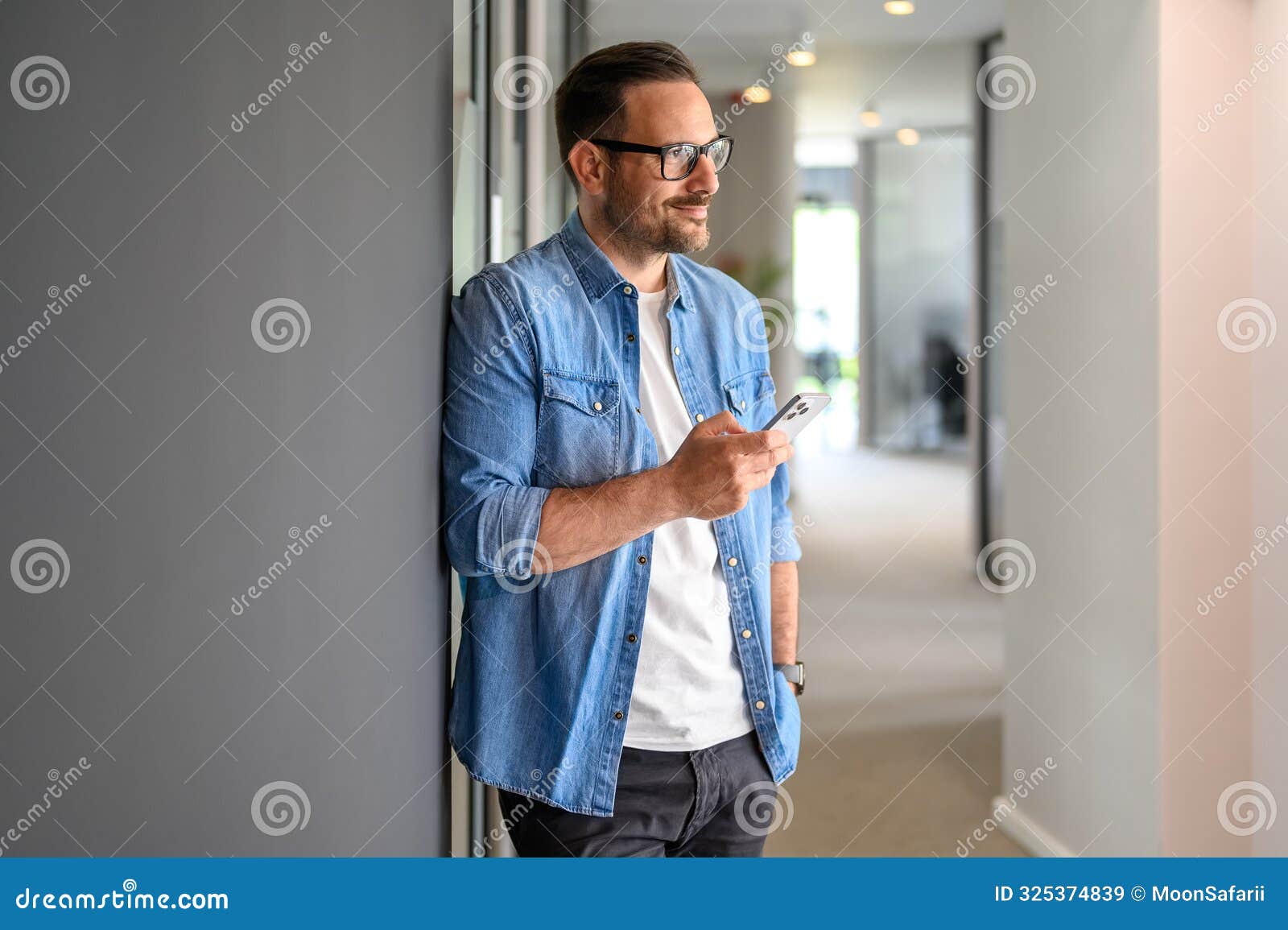 Male Software Programmer in Glasses Looking Away Thoughtfully while ...