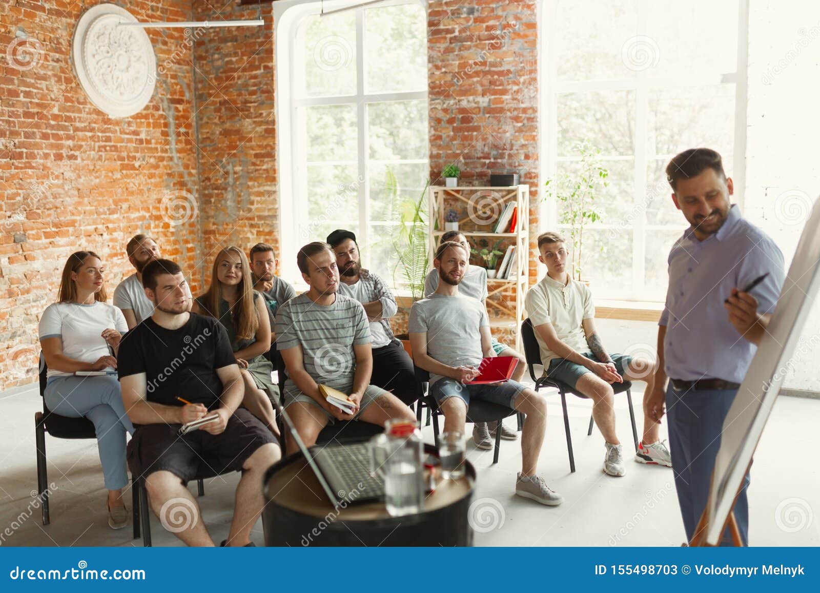 Male Speaker Giving Presentation in Hall at University Workshop Stock ...