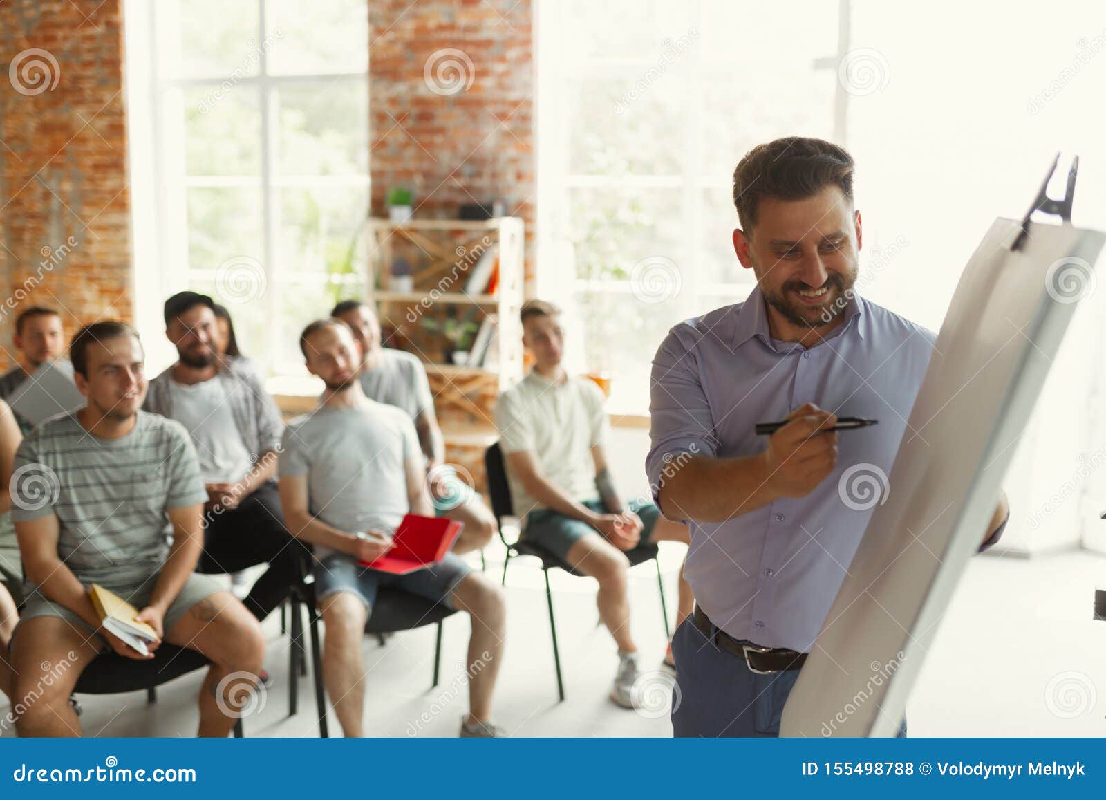 Male Speaker Giving Presentation in Hall at University Workshop Stock ...