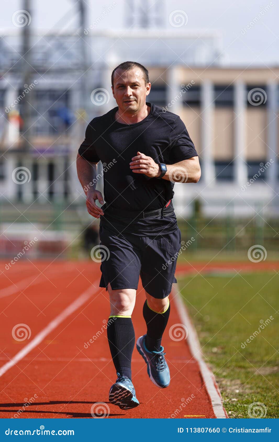 Male Sprinter in Middle Age Trains for Race Stock Photo - Image of ...