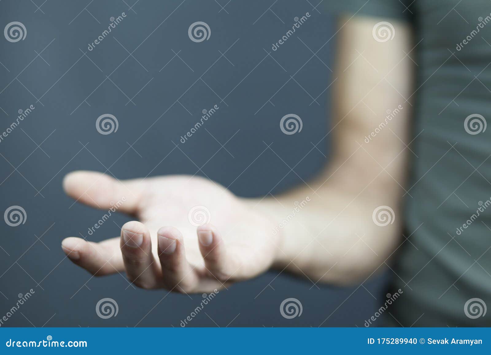 Male is Standing and Shows Outstretched Hand with Open Palm Stock Photo ...