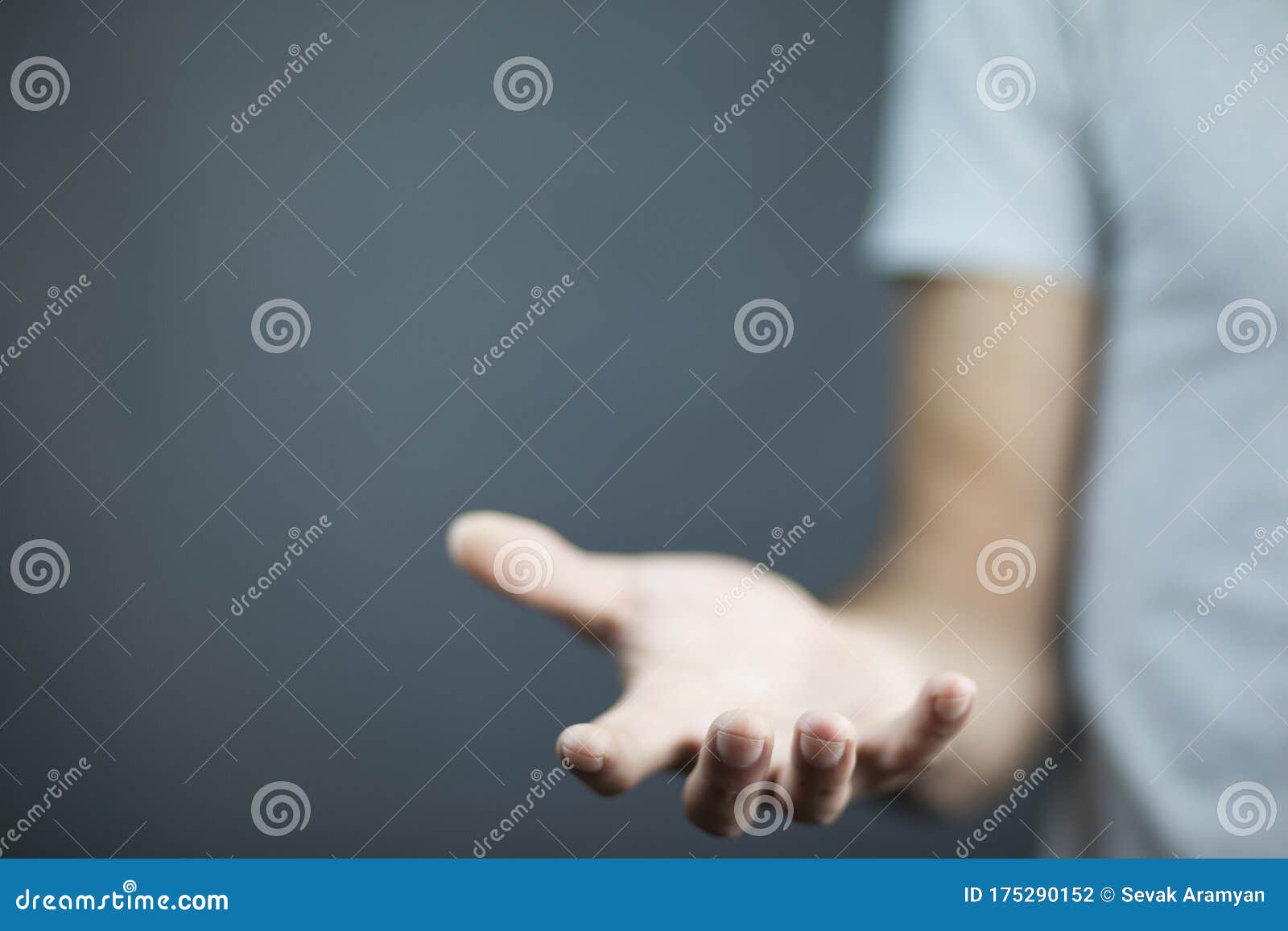Male is Standing and Shows Outstretched Hand with Open Palm Stock Photo ...