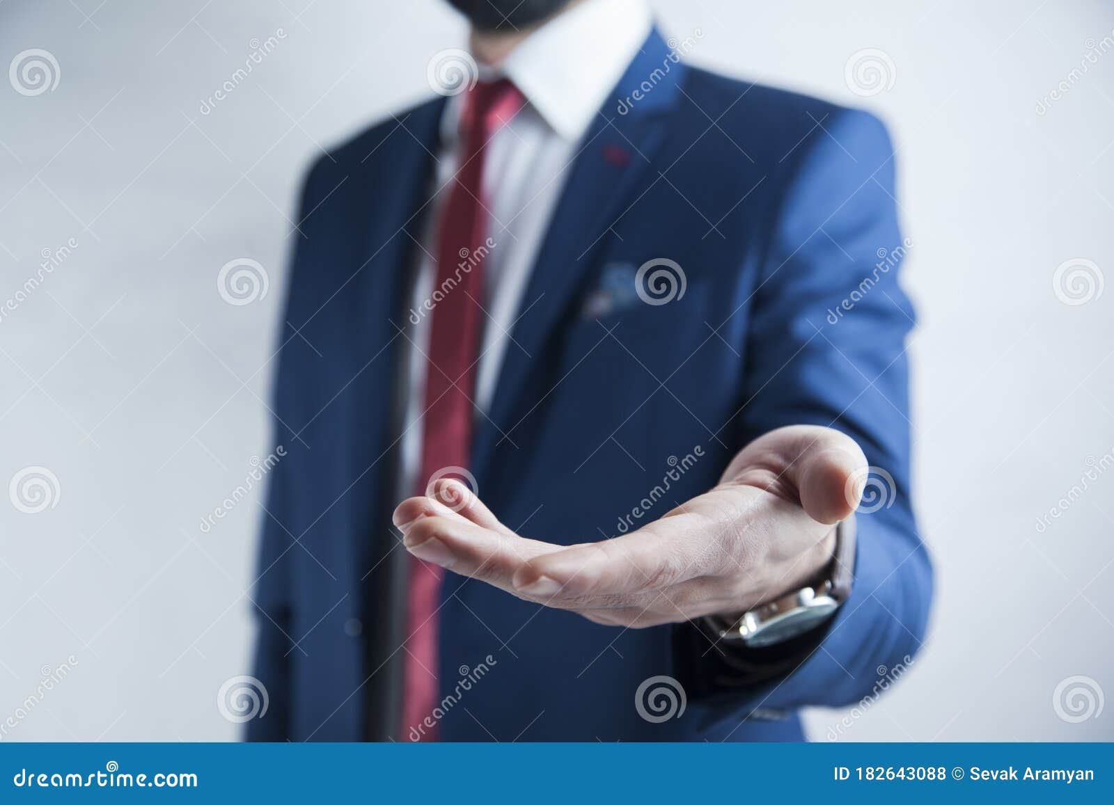Male is Standing and Shows Outstretched Hand with Open Palm Stock Photo ...