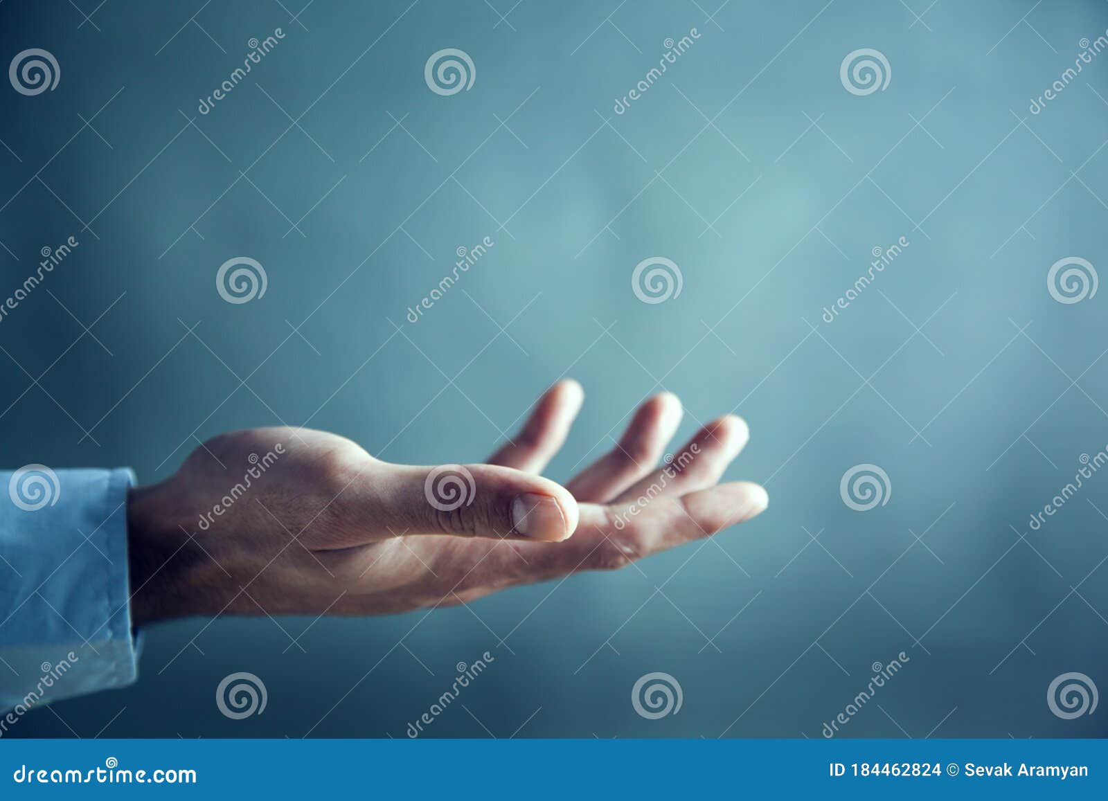 Male is Standing and Shows Outstretched Hand with Open Palm Stock Photo ...