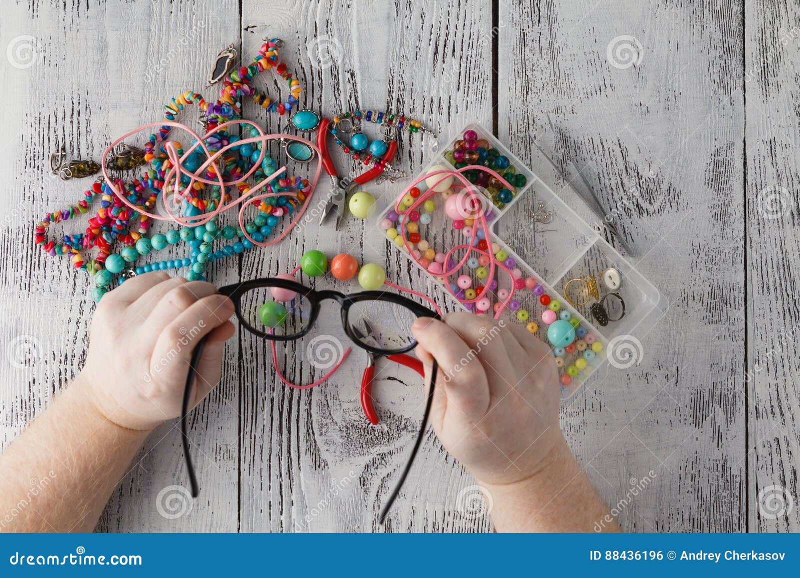 Male Stringing Beads on the Needle Stock Photo - Image of bright, jewel ...