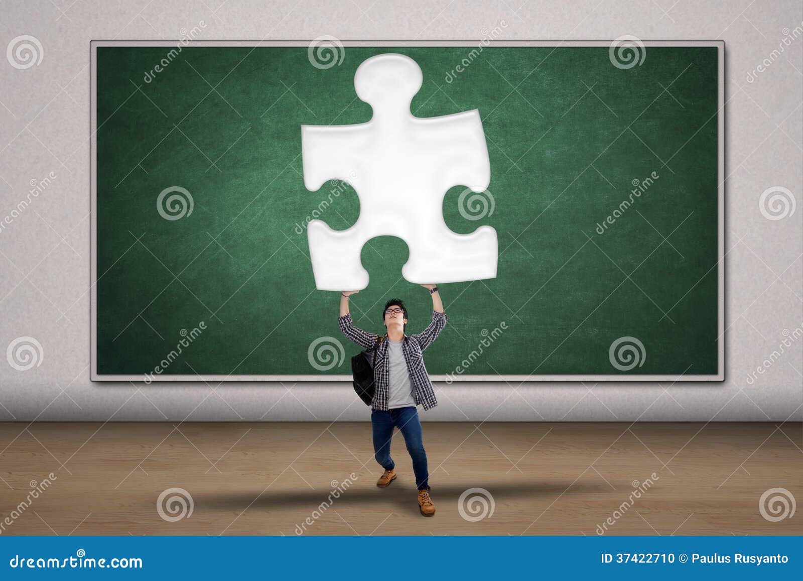 Male Student Carrying a Puzzle Stock Photo - Image of blackboard ...
