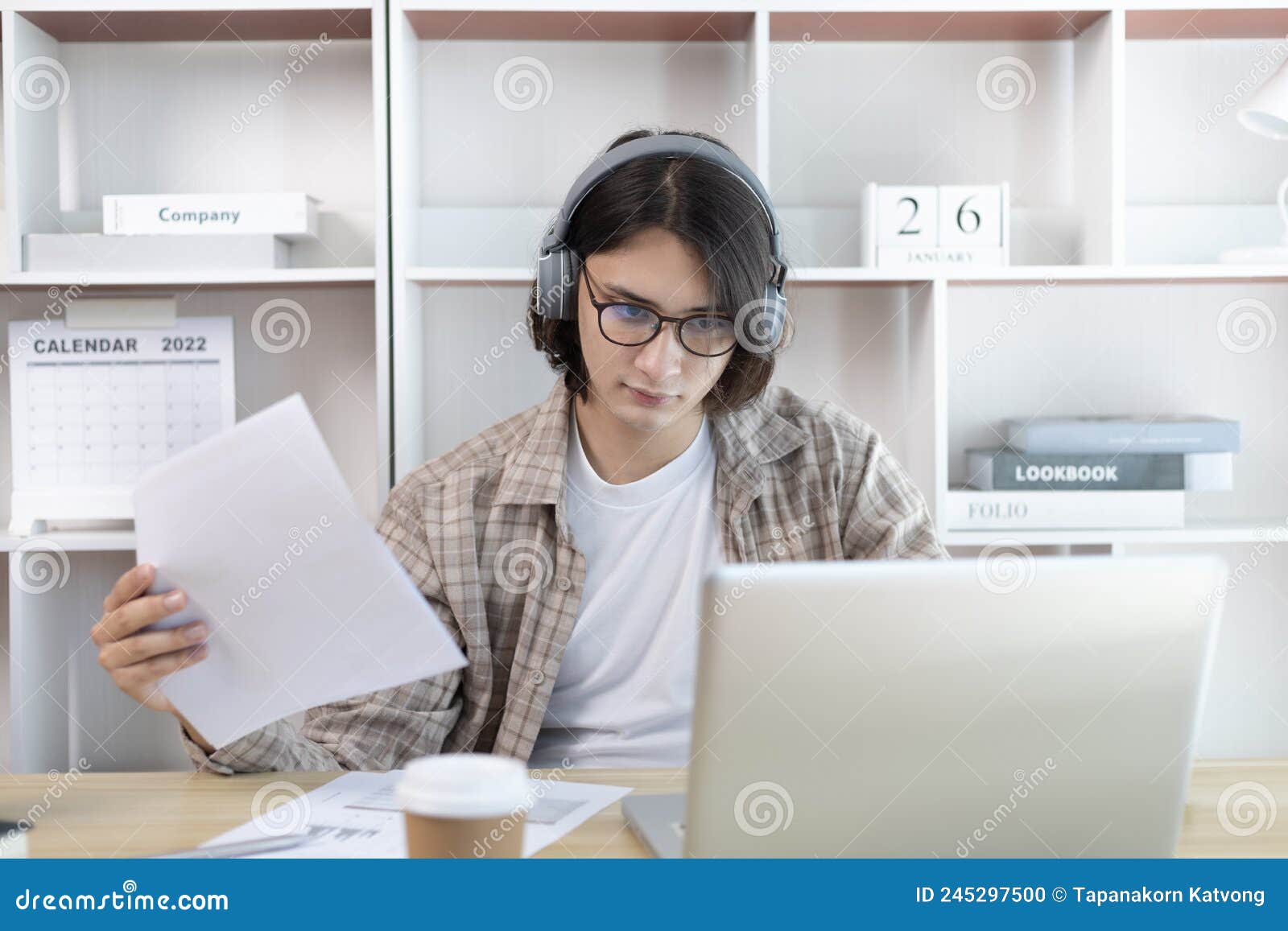 Male Student is Doing Homework Given by the Teacher through the Laptop ...