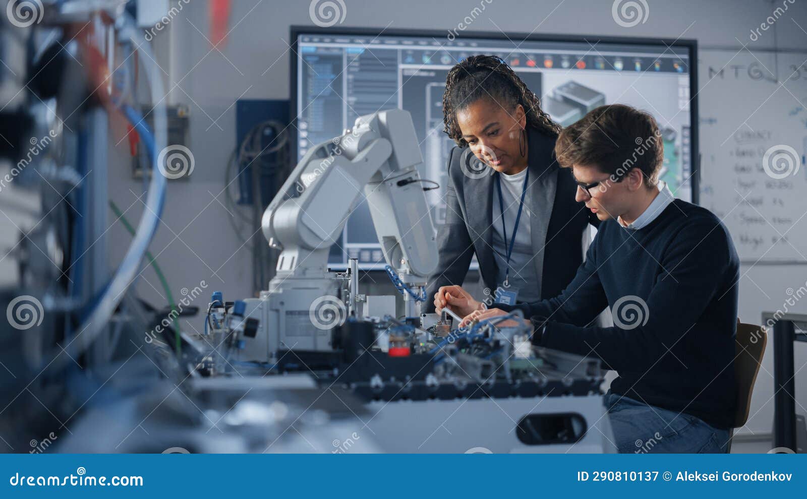 Male Student Engineer Discussing Ideas with Black Teacher while Working ...