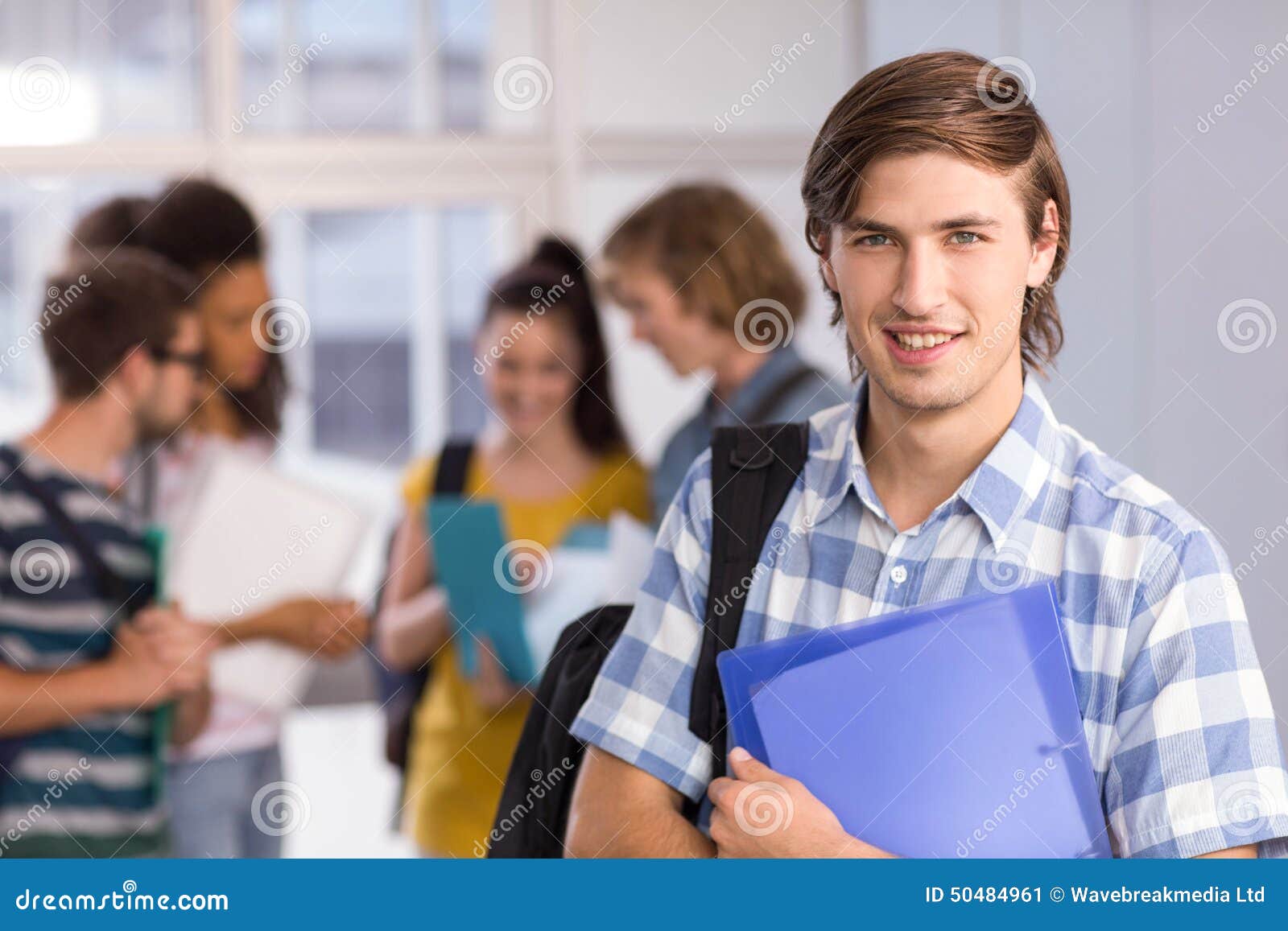 Male Student Holding Folder in College Stock Image - Image of ...
