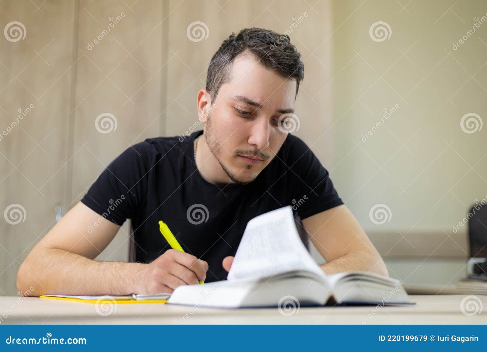 Male Student in the Learning Process with a Pen and Abstract Stock ...