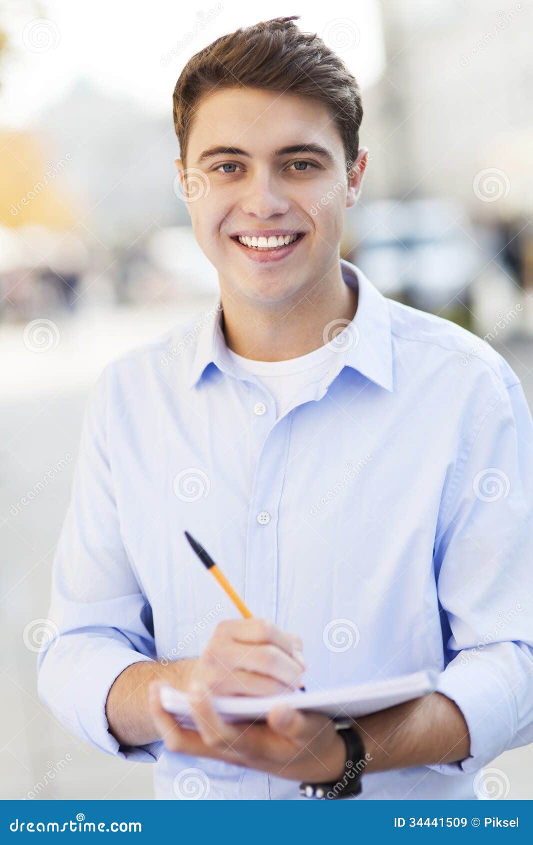 Male Student with Pen and Notebook Stock Image - Image of casual, scene ...