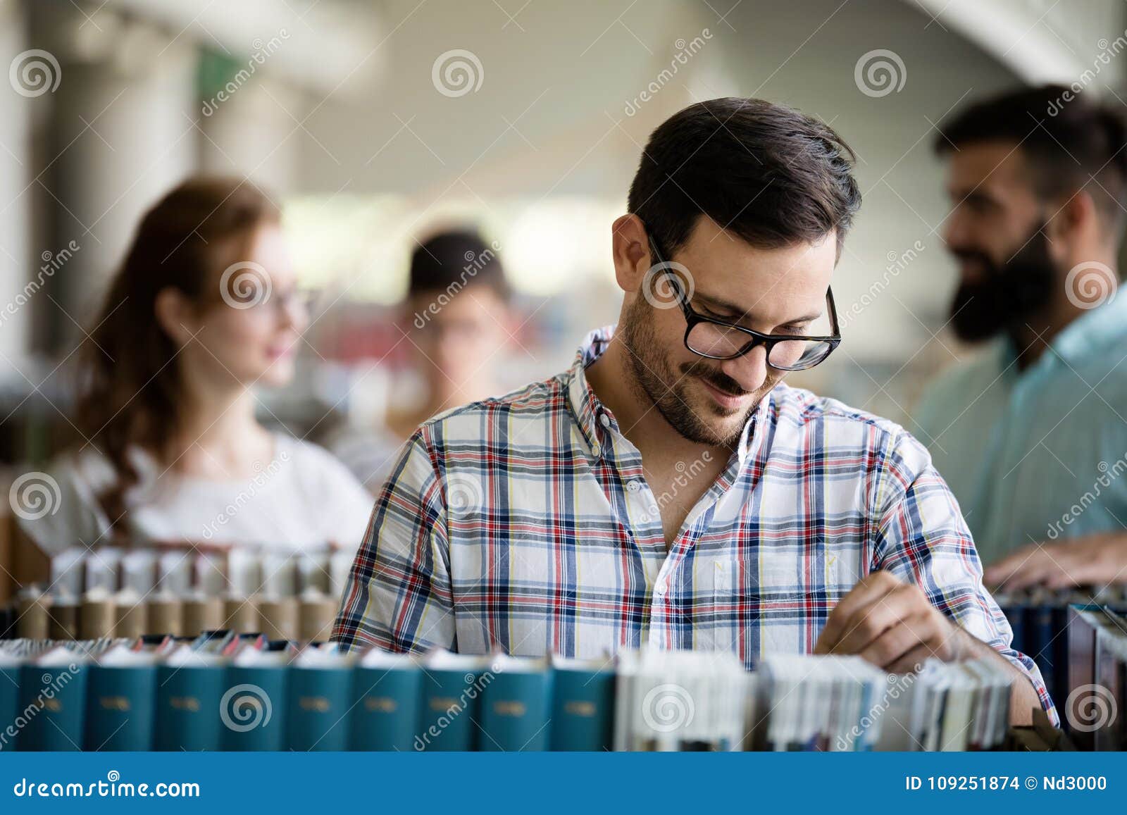 Male Student Picking a Book in a Library Stock Photo - Image of ...