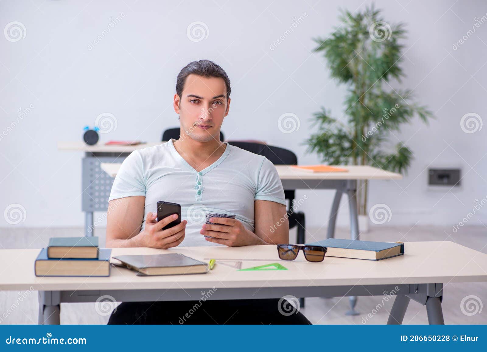 Young Male Student Playing Cards during Exam Preparation in the Stock ...