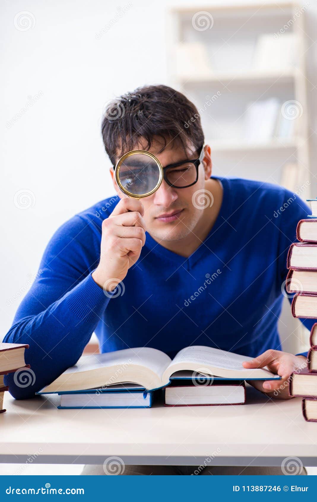 The Male Student Preparing for Exams in College Library Stock Photo ...