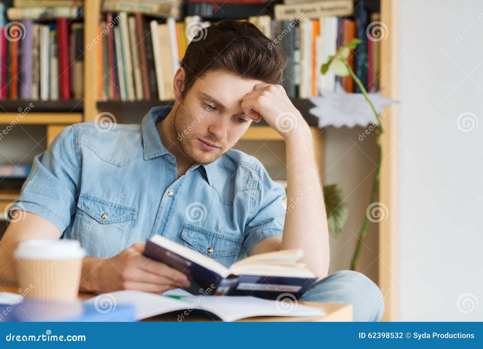 Male Student Reading Book in Library Stock Photo - Image of people ...