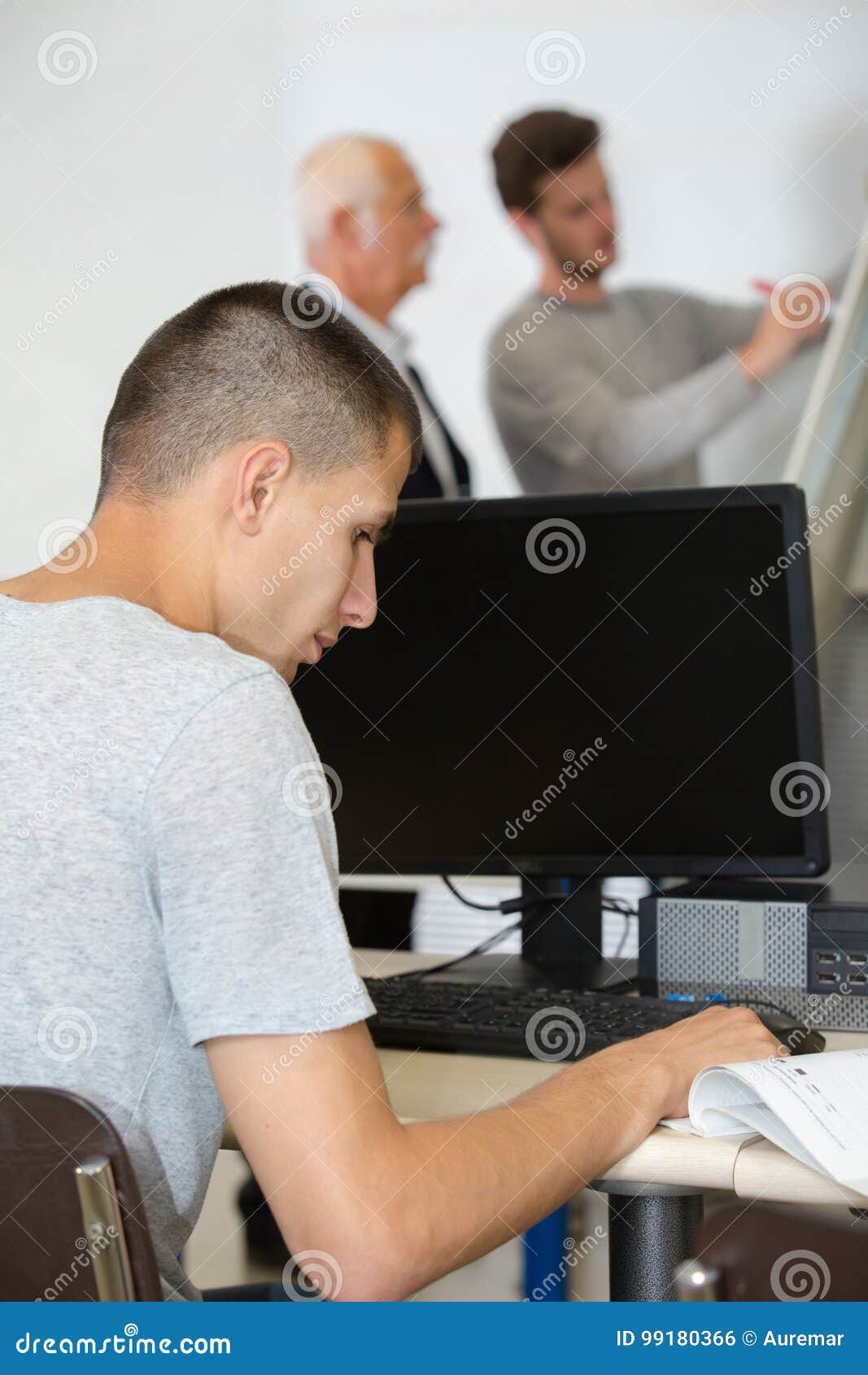 Male Student Sitting in Front Computer in Classroom Stock Photo - Image ...
