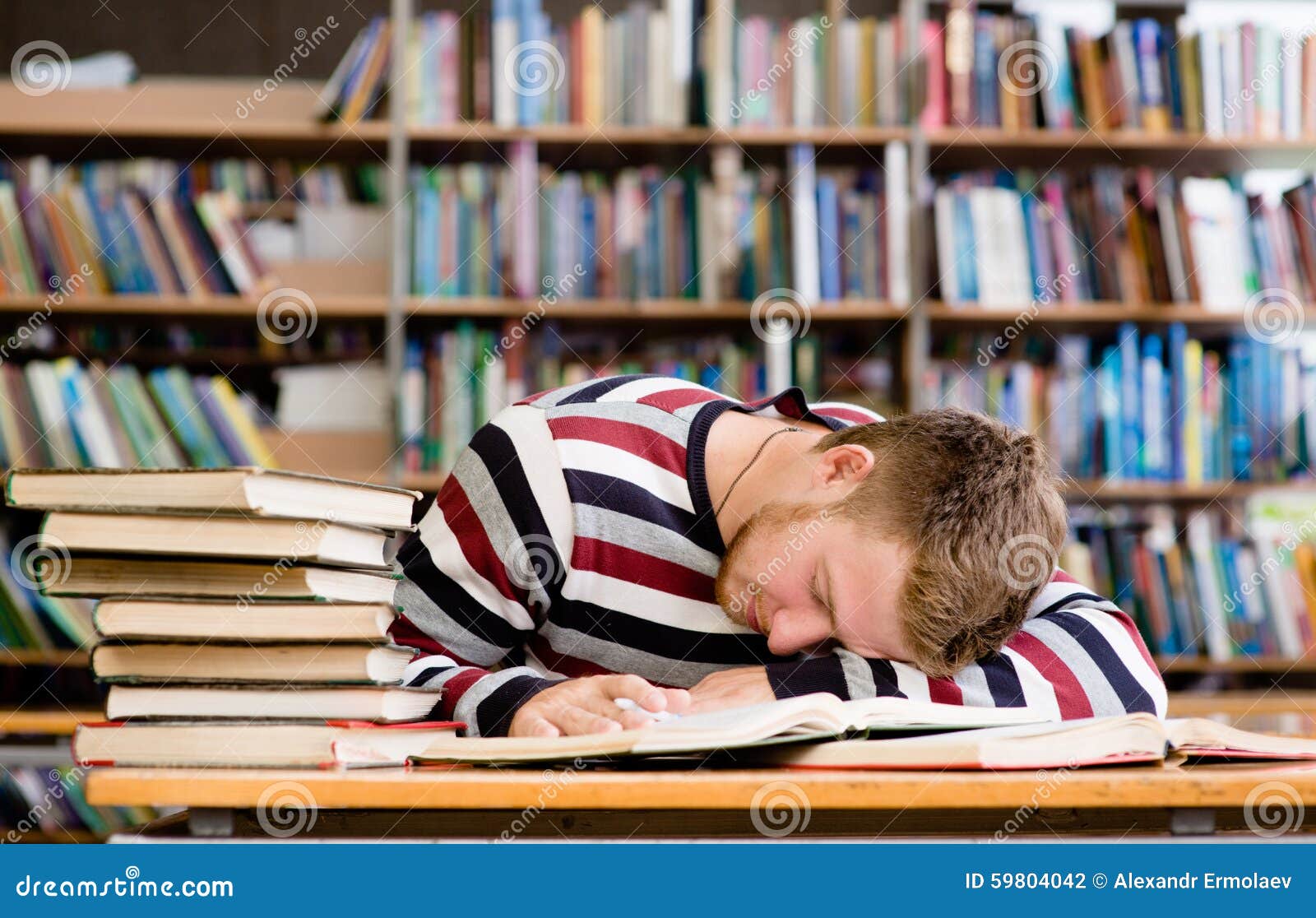 Male Student Sleeping in Library Stock Photo - Image of lying, academic ...