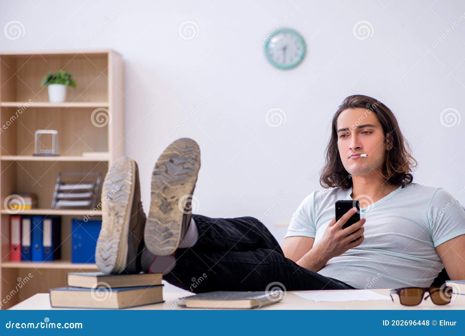 Young Male Student Smoking Cigarettes in the Classroom Stock Photo ...