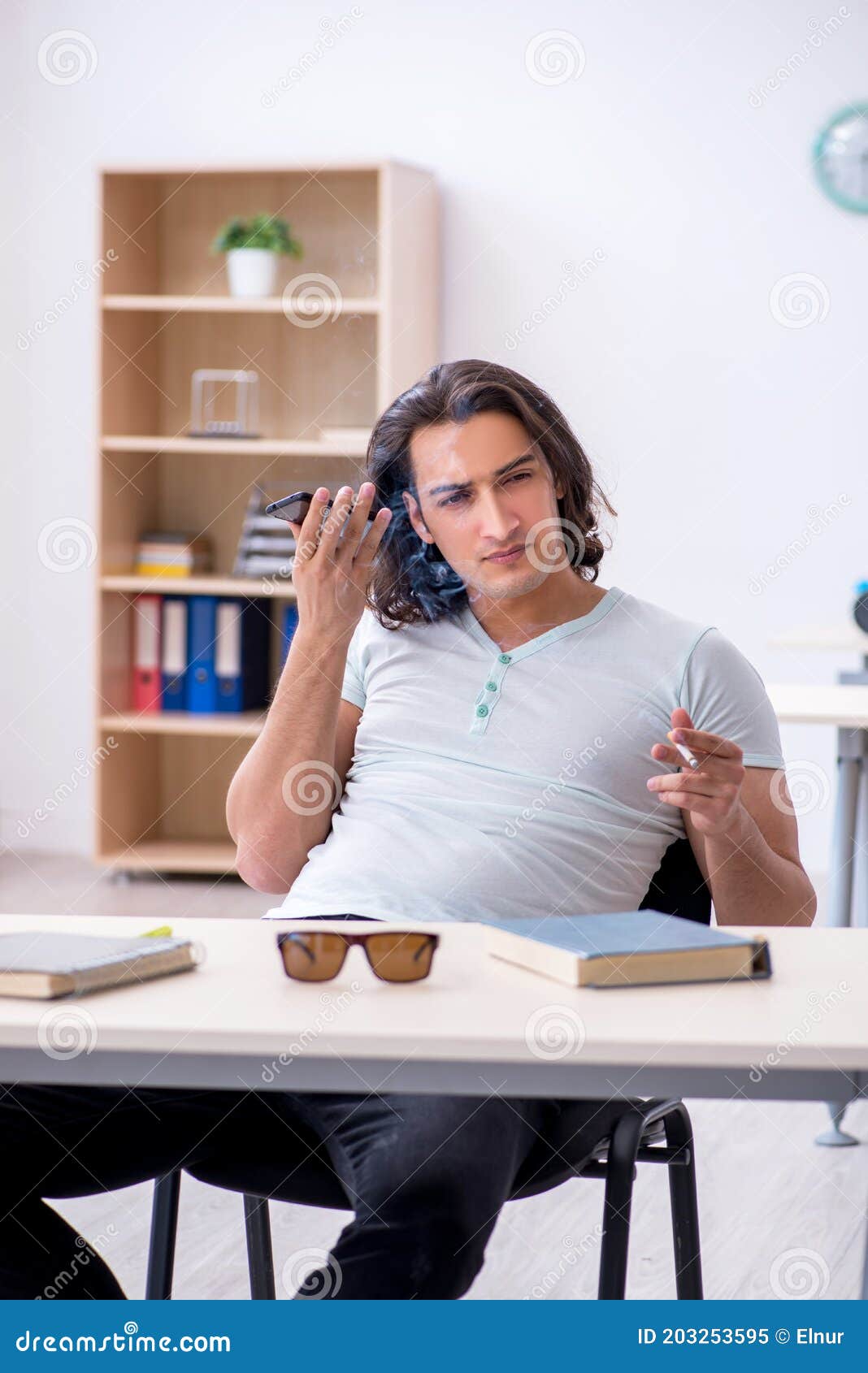 Young Male Student Smoking Cigarettes in the Classroom Stock Image ...