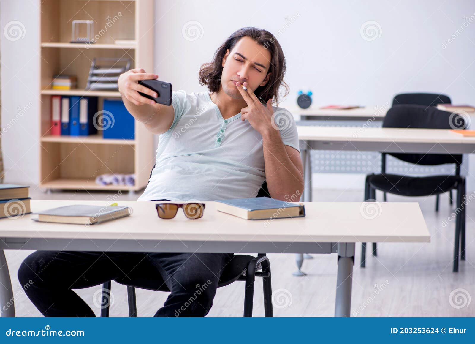 Young Male Student Smoking Cigarettes in the Classroom Stock Photo ...