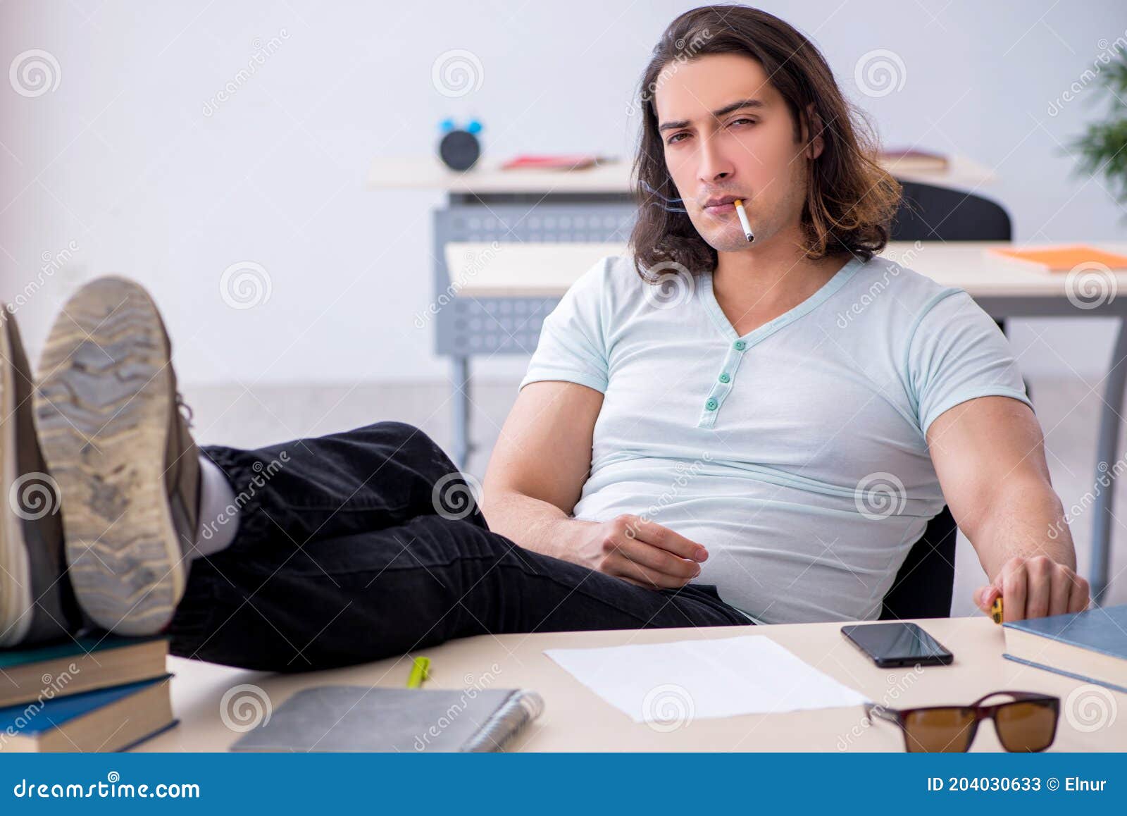 Young Male Student Smoking Cigarettes in the Classroom Stock Image ...