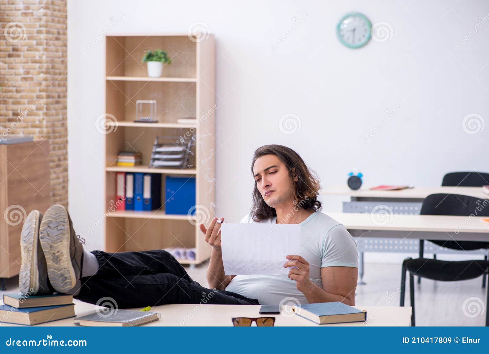 Young Male Student Smoking Cigarettes in the Classroom Stock Image ...