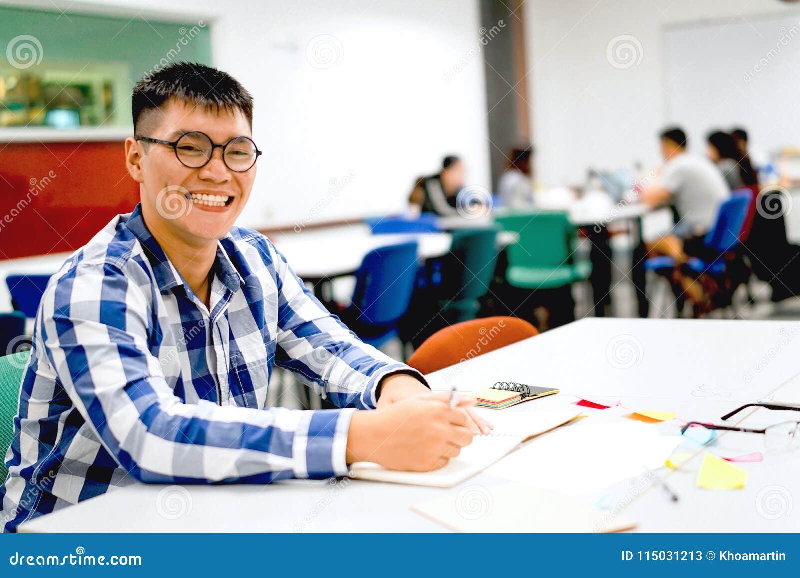Male Student Study in the Campus | Smiling and Doing Homework Stock ...