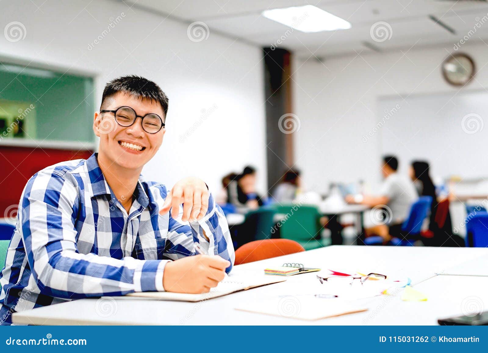 Male Student Study in the Campus | Smiling and Doing Homework Stock ...