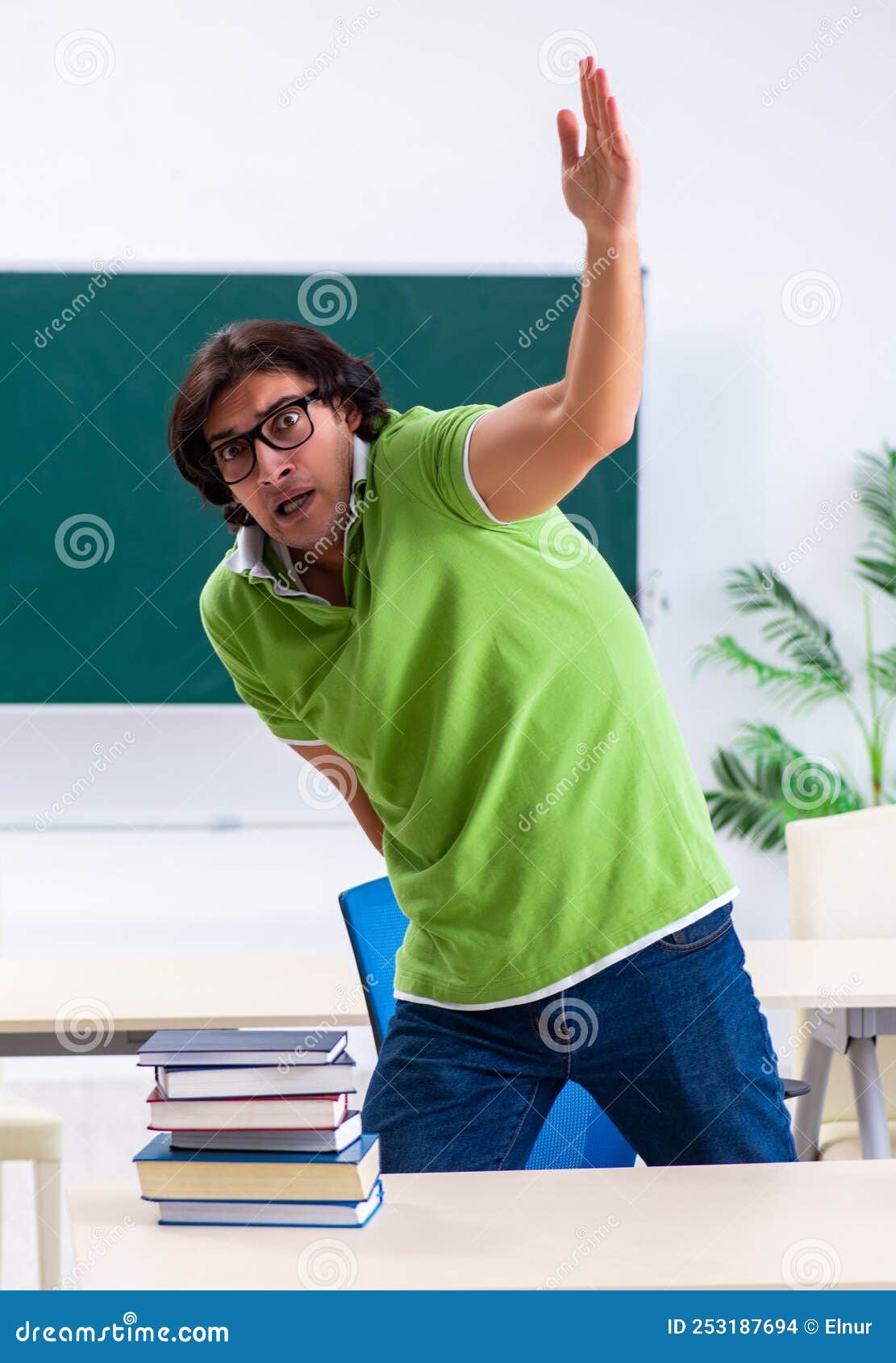 Male Student Suffering from Urge in the Classroom Stock Photo - Image ...
