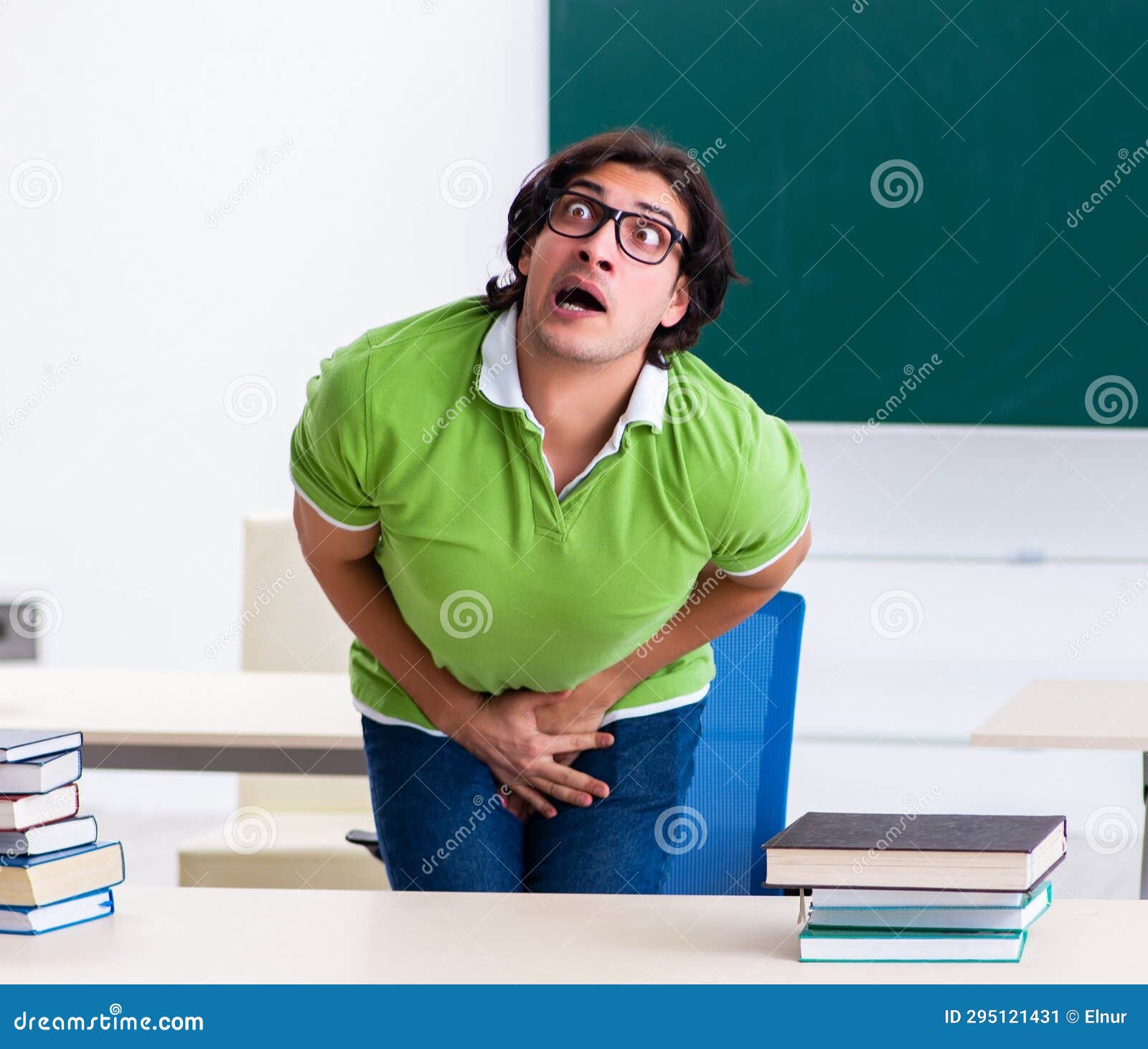 Male Student Suffering from Urge in the Classroom Stock Image - Image ...