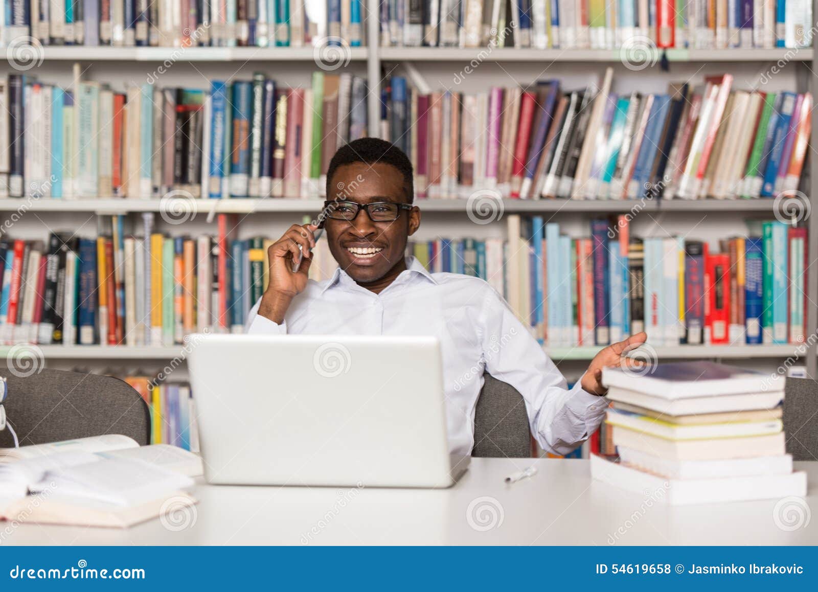 Male Student Talking on the Phone in Library Stock Photo - Image of ...