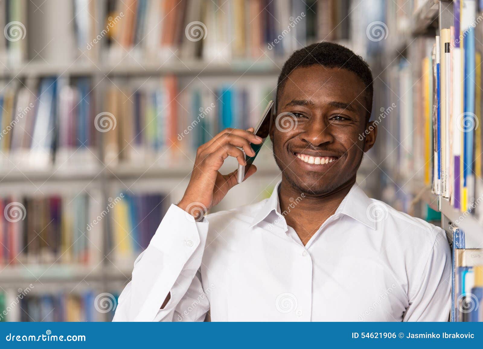Male Student Talking on the Phone in Library Stock Photo - Image of ...