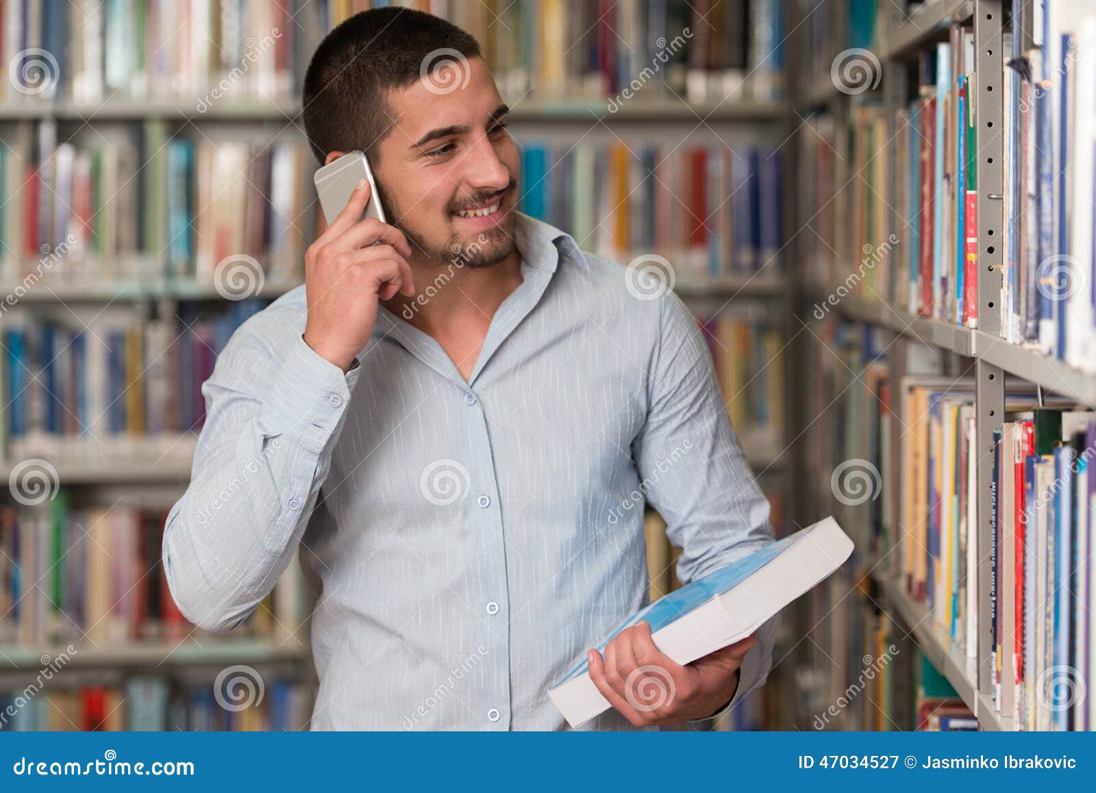 Male Student Talking on the Phone in Library Stock Image - Image of ...