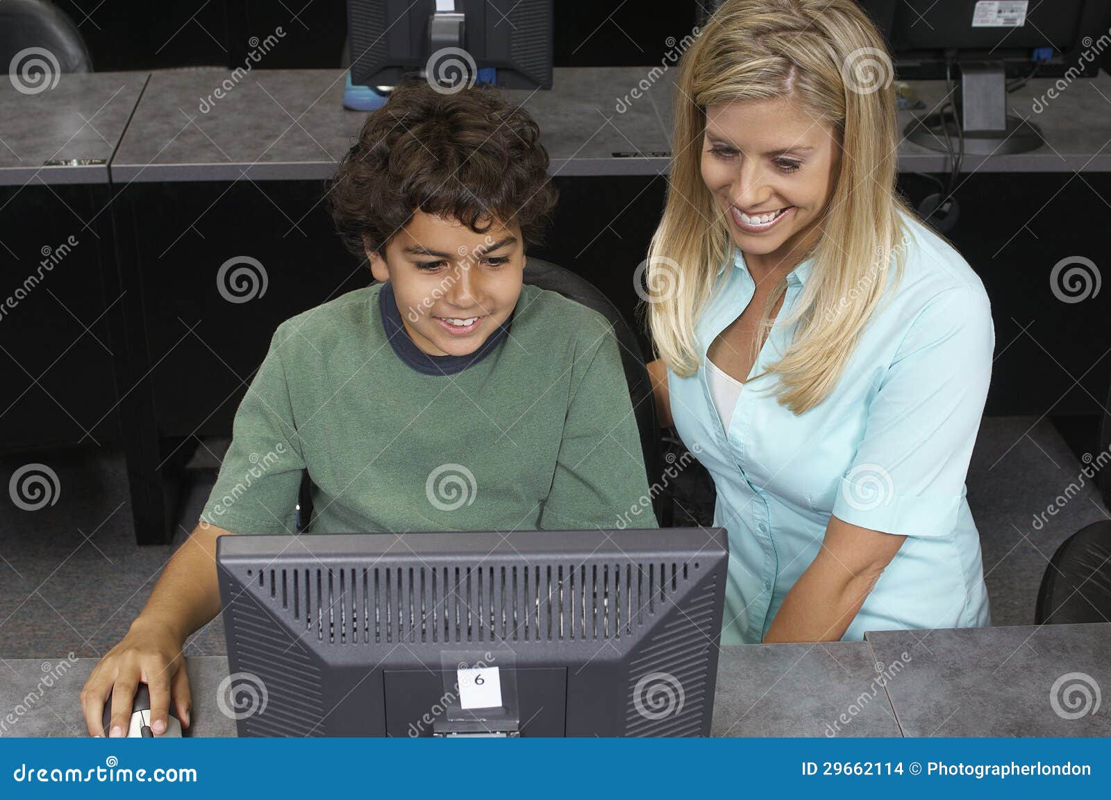 Male Student and Teacher Using Computer Stock Photo - Image of ...
