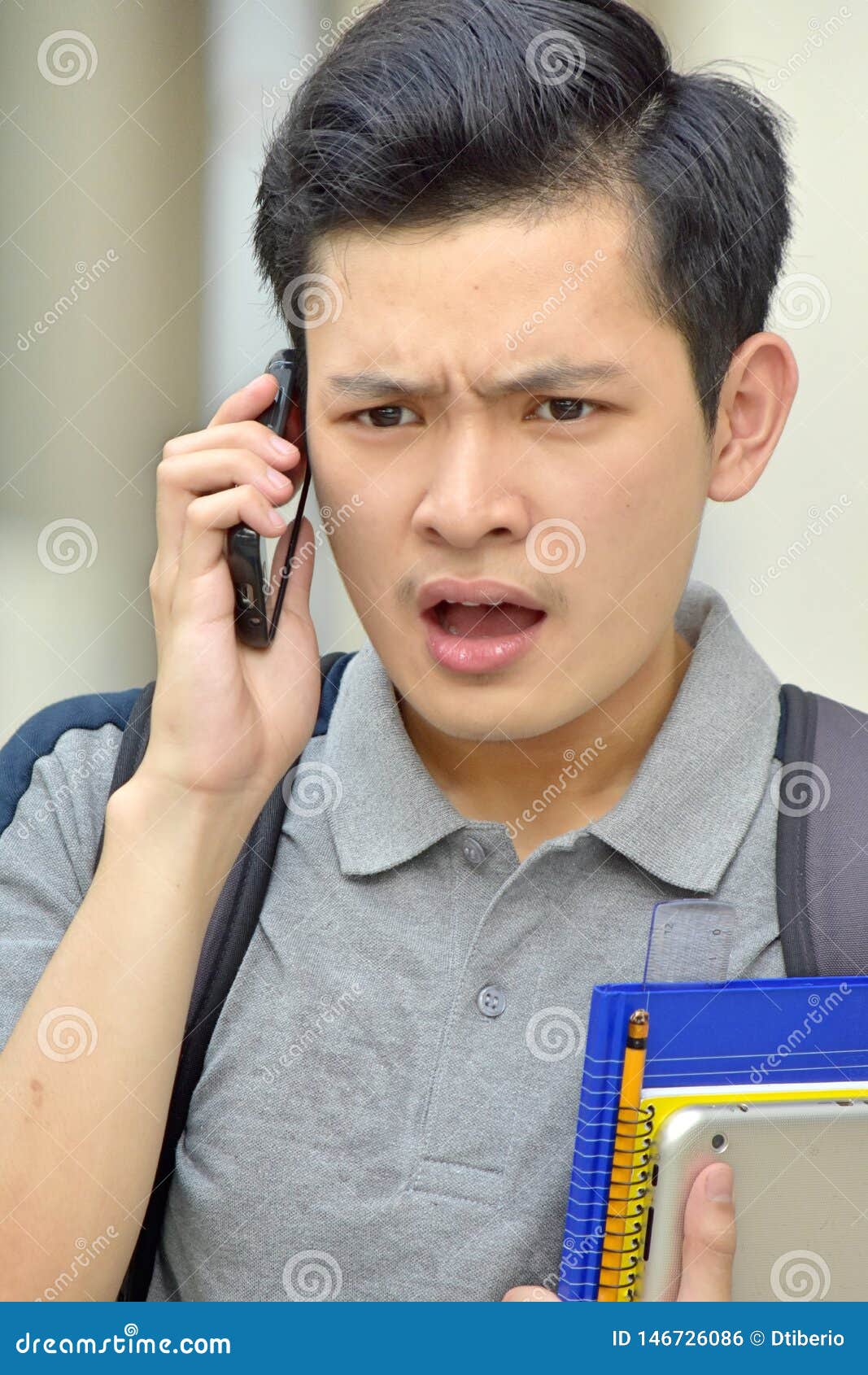 Male Student Using Cell Phone and Unhappy Stock Photo - Image of ...