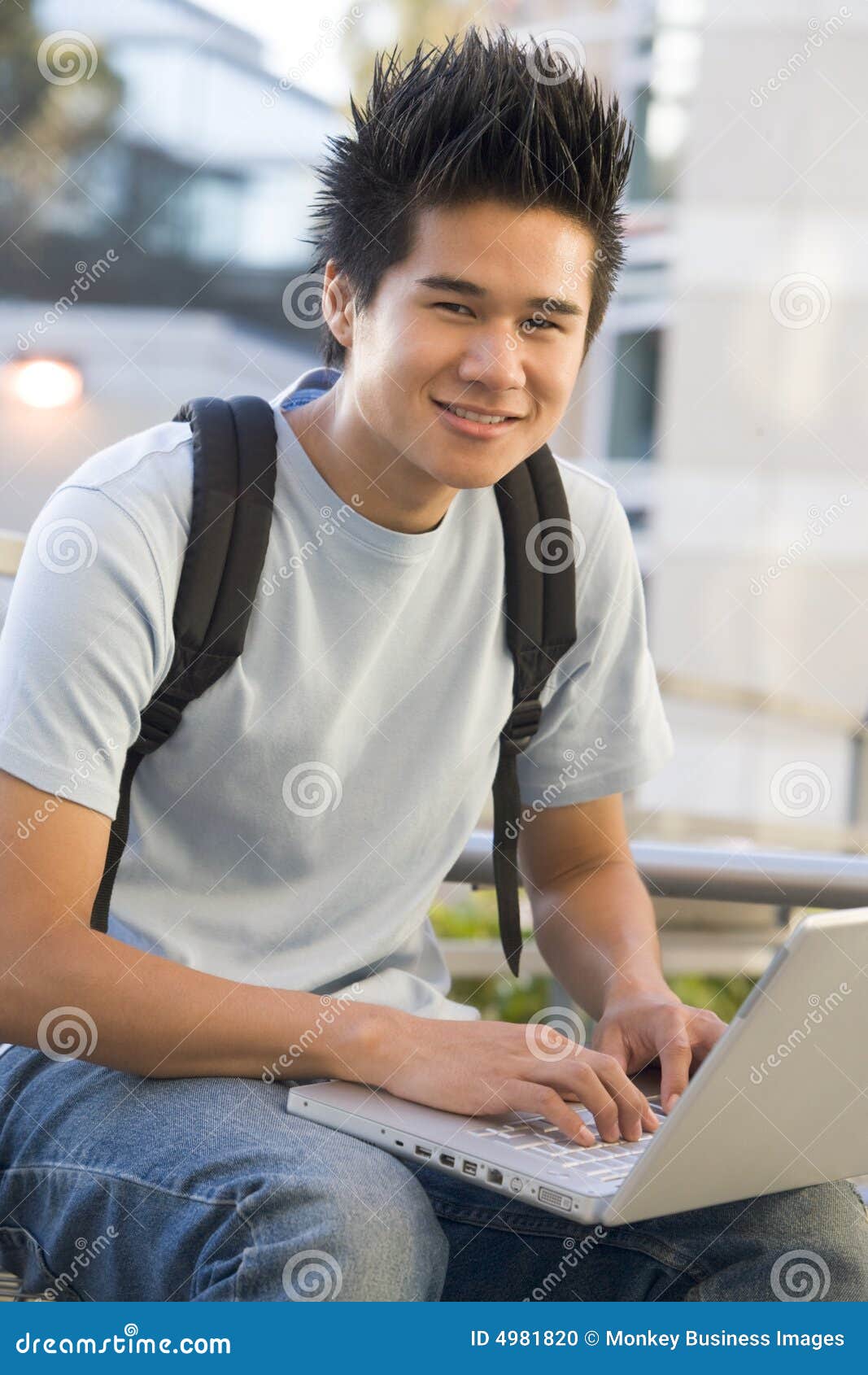 Male Student Using Laptop Outside Stock Photo - Image of person ...
