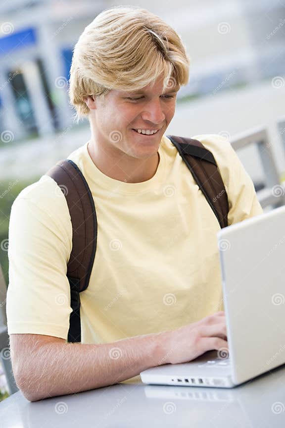 Male Student Using Laptop Outside Stock Photo - Image of colour ...