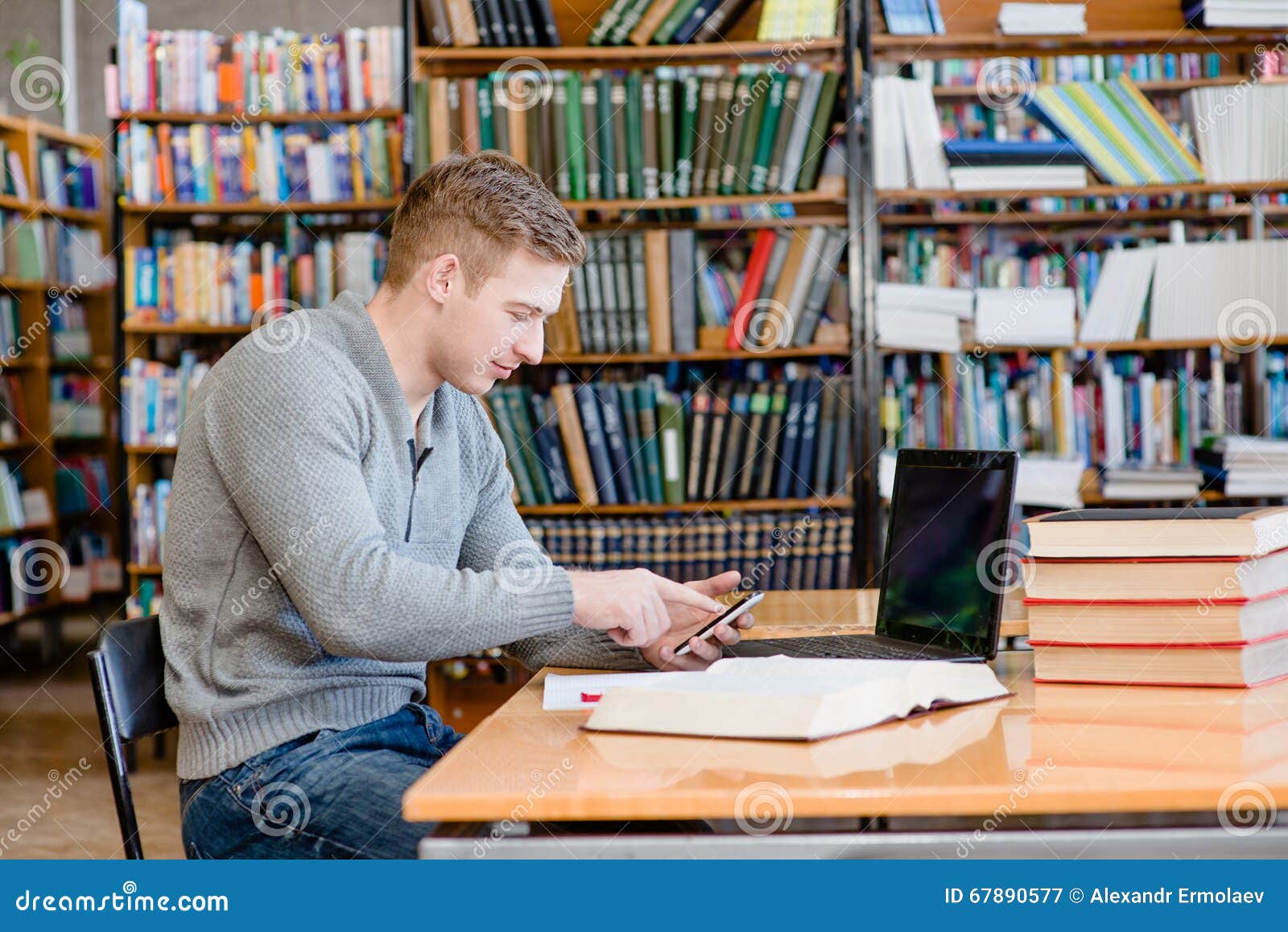Male Student Using Smartphone in the University Library Stock Image ...