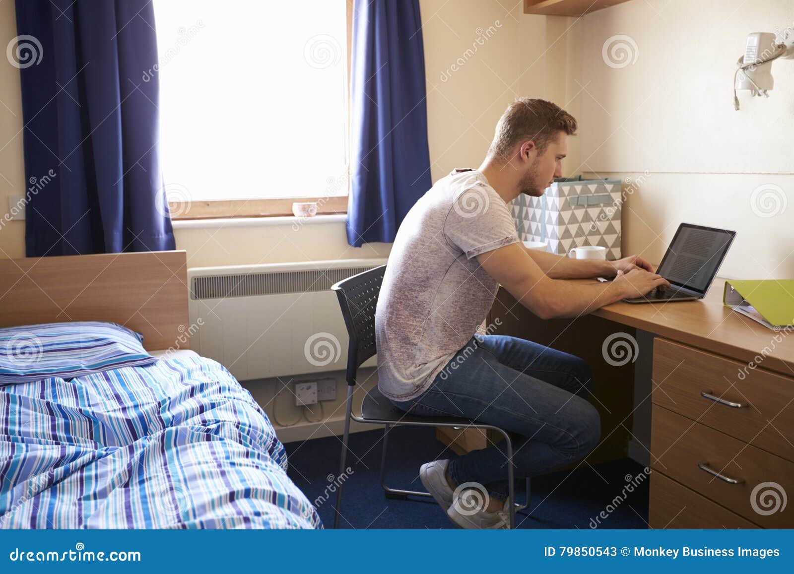 Male Student Working in Bedroom of Campus Accommodation Stock Image ...