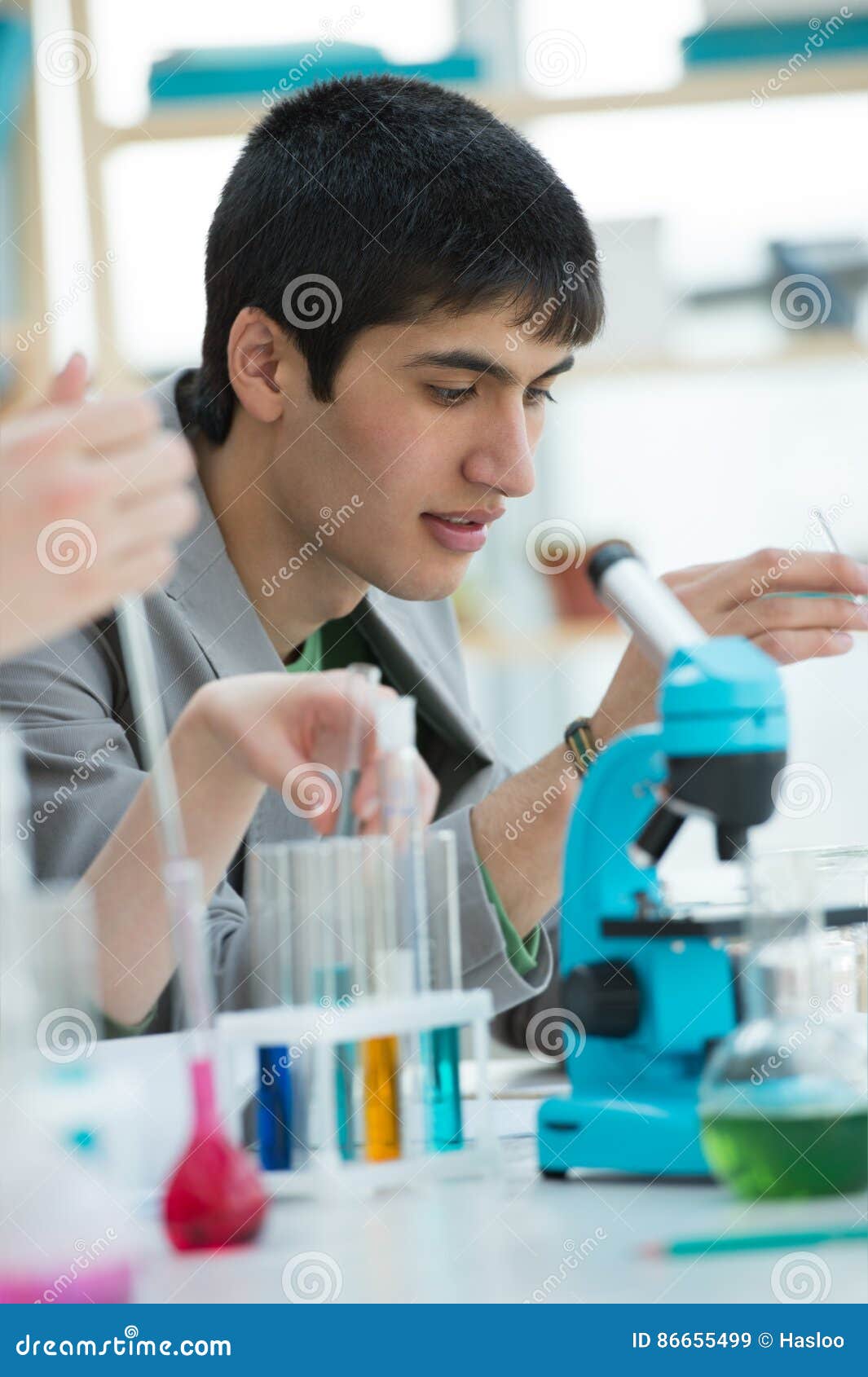 Male Student Working with Microscope Stock Image - Image of looking ...