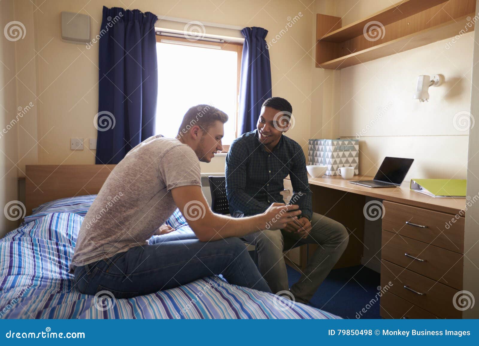 Male Students Working in Bedroom of Campus Accommodation Stock Photo ...