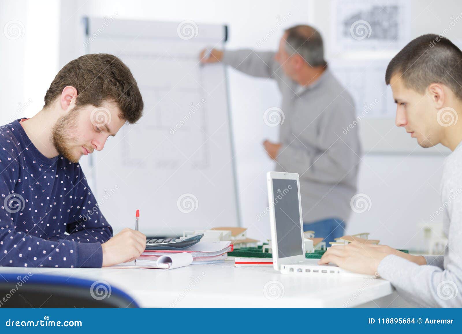 Male Students Working in Classroom Stock Photo - Image of talking ...