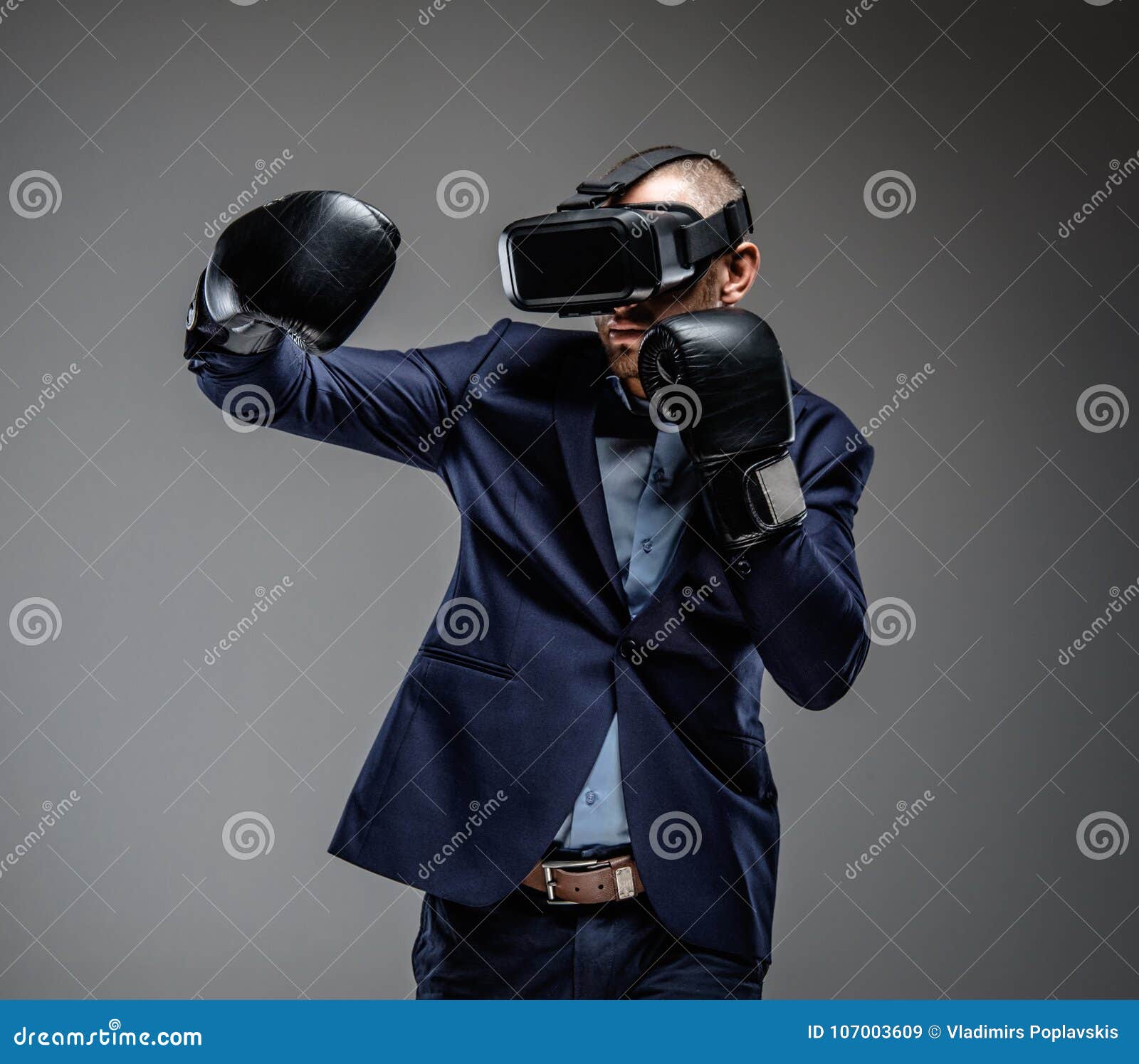 Male in a Suit Fighting with Virtual Reality Glasses on His Head Stock ...
