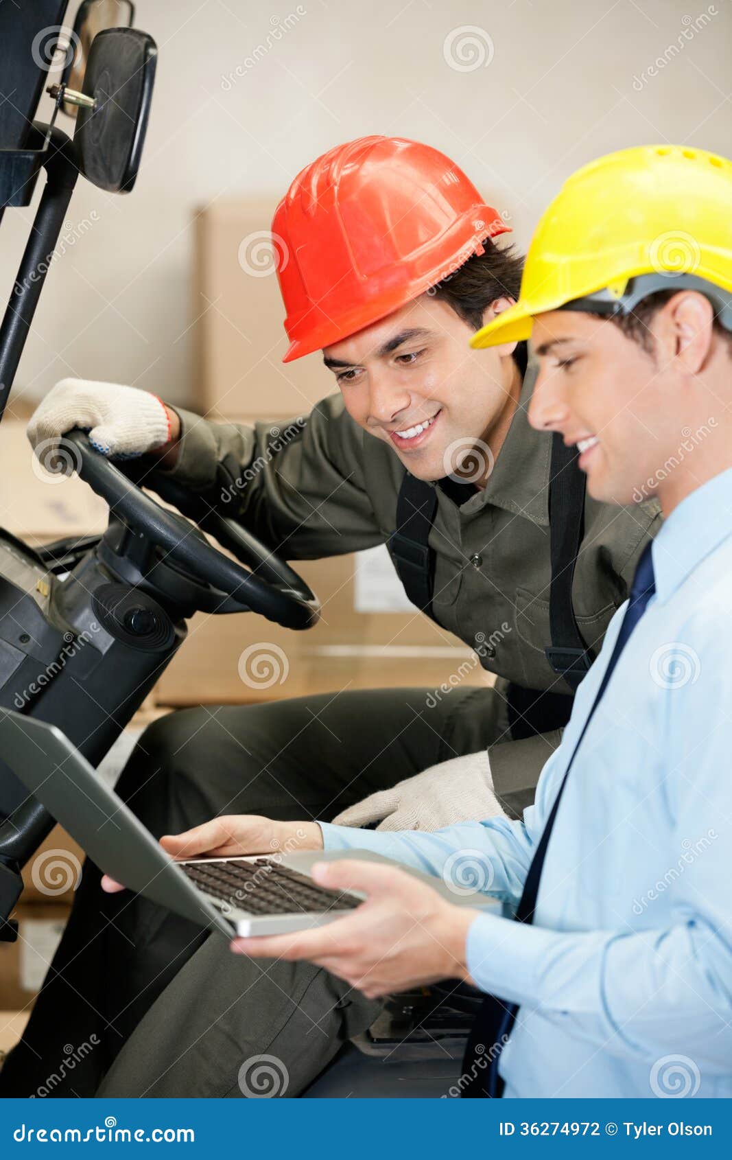 Male Supervisor and Forklift Driver Using Laptop Stock Photo - Image of ...