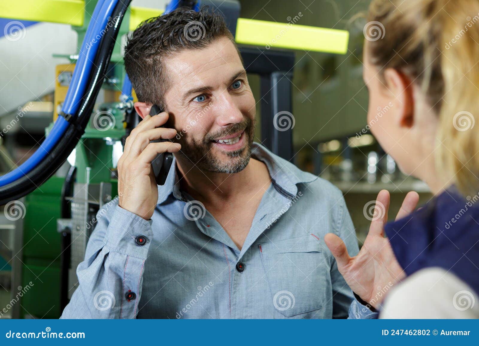 Male Supervisor Talking on Mobile Phone in Industry Stock Photo - Image ...