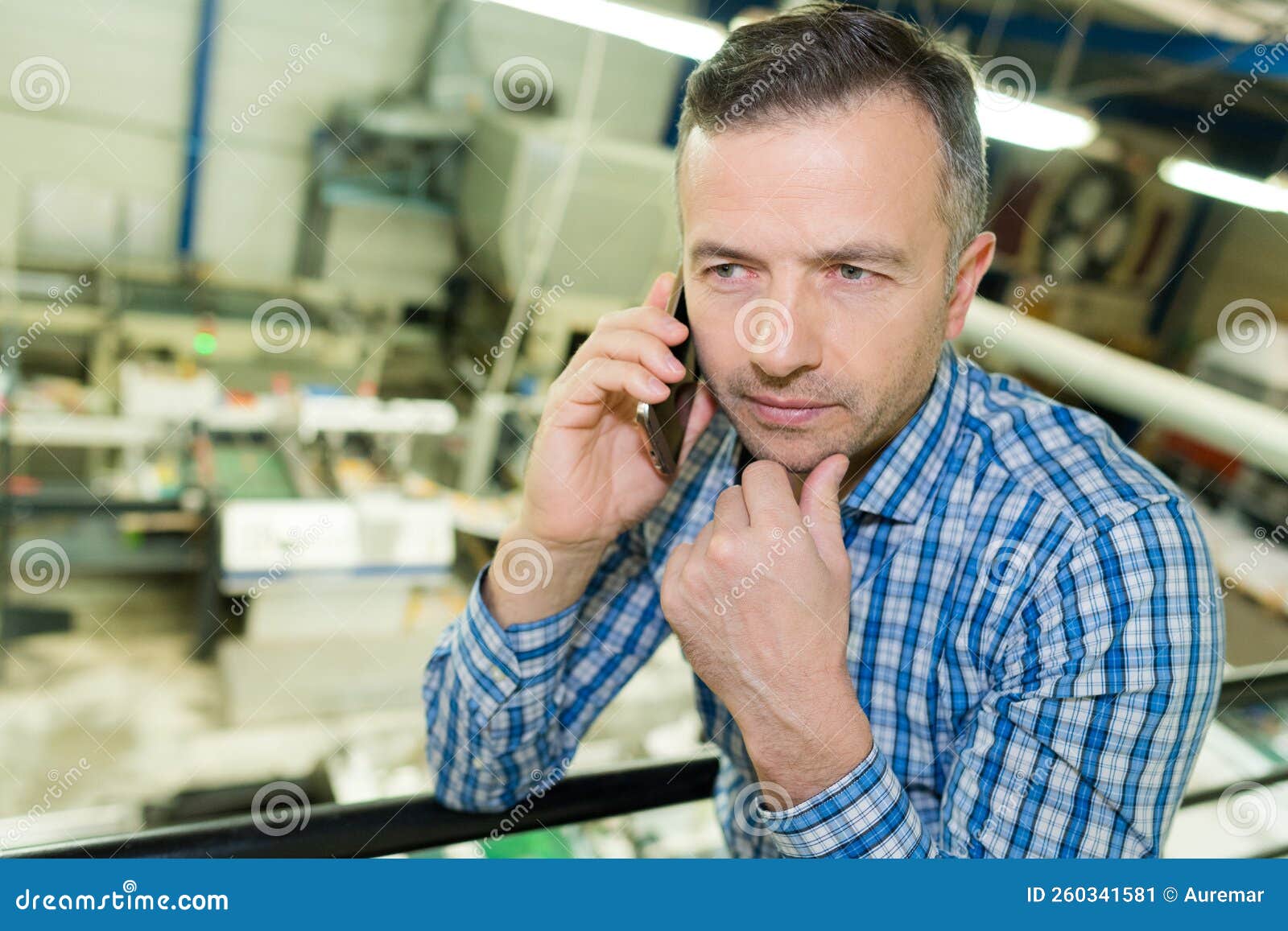Male Supervisor Talking on Mobile Phone in Industry Stock Image - Image ...