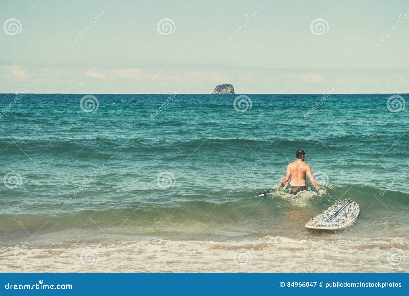 Male Surfer With Surfboard In Ocean Picture. Image: 84966047
