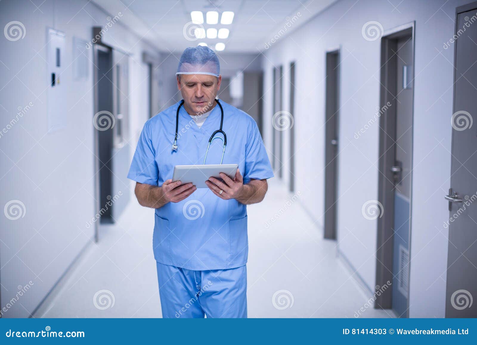 Male Surgeon Using Digital Tablet Stock Image - Image of adult ...