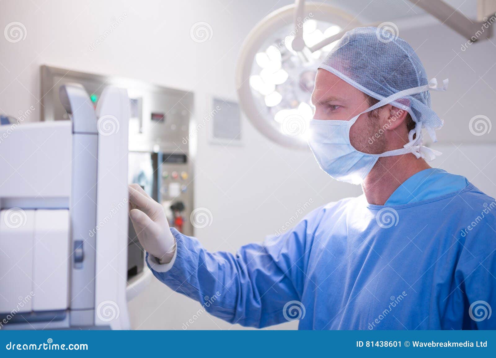 Male Surgeon Using Machine in Operation Theater Stock Image - Image of ...