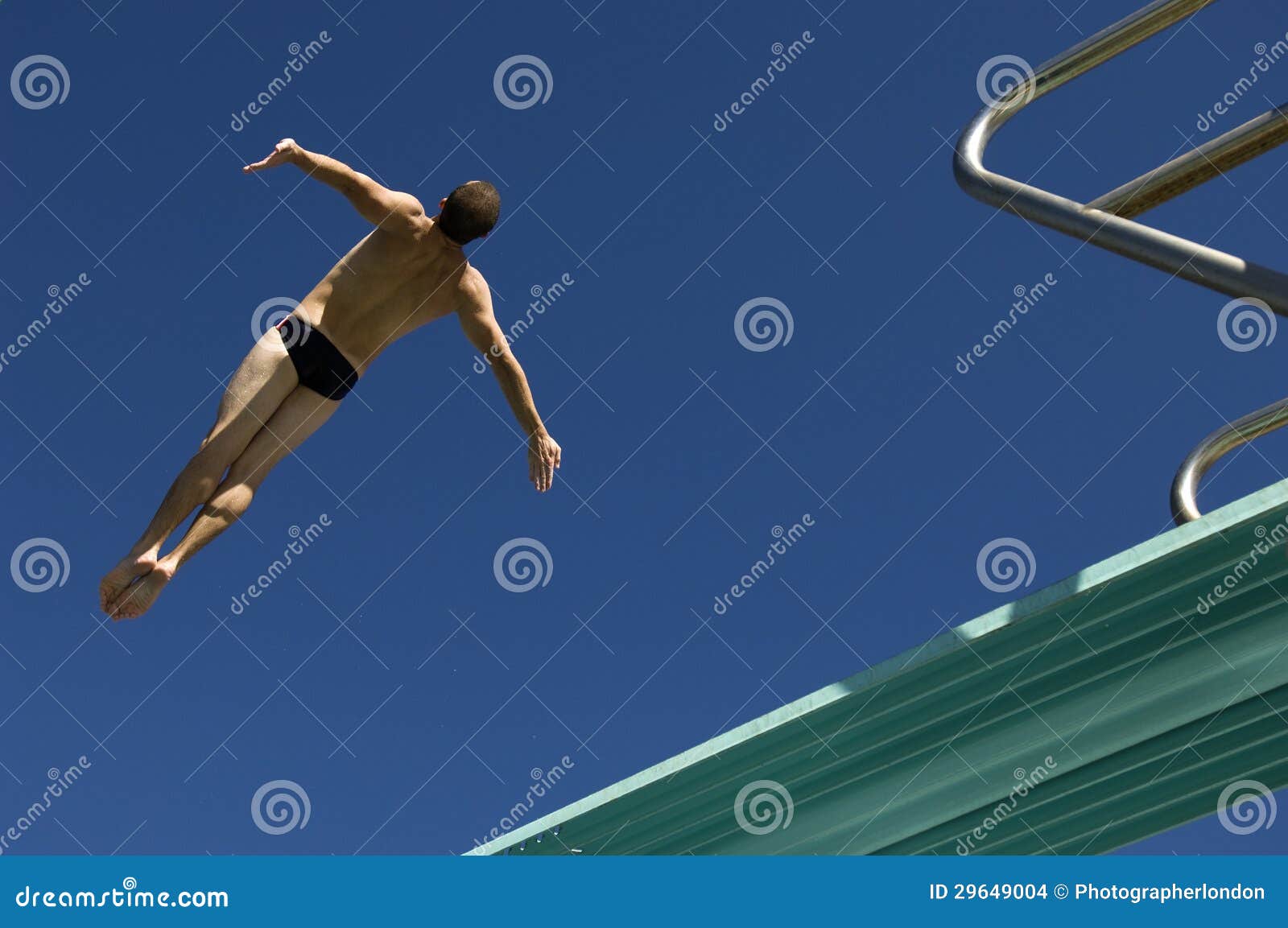 Male Swimmer Diving from Springboard Stock Photo - Image of outdoors ...